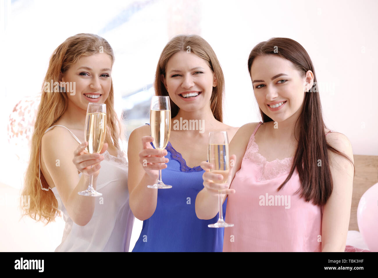 Beautiful young women drinking champagne at hen party Stock Photo - Alamy