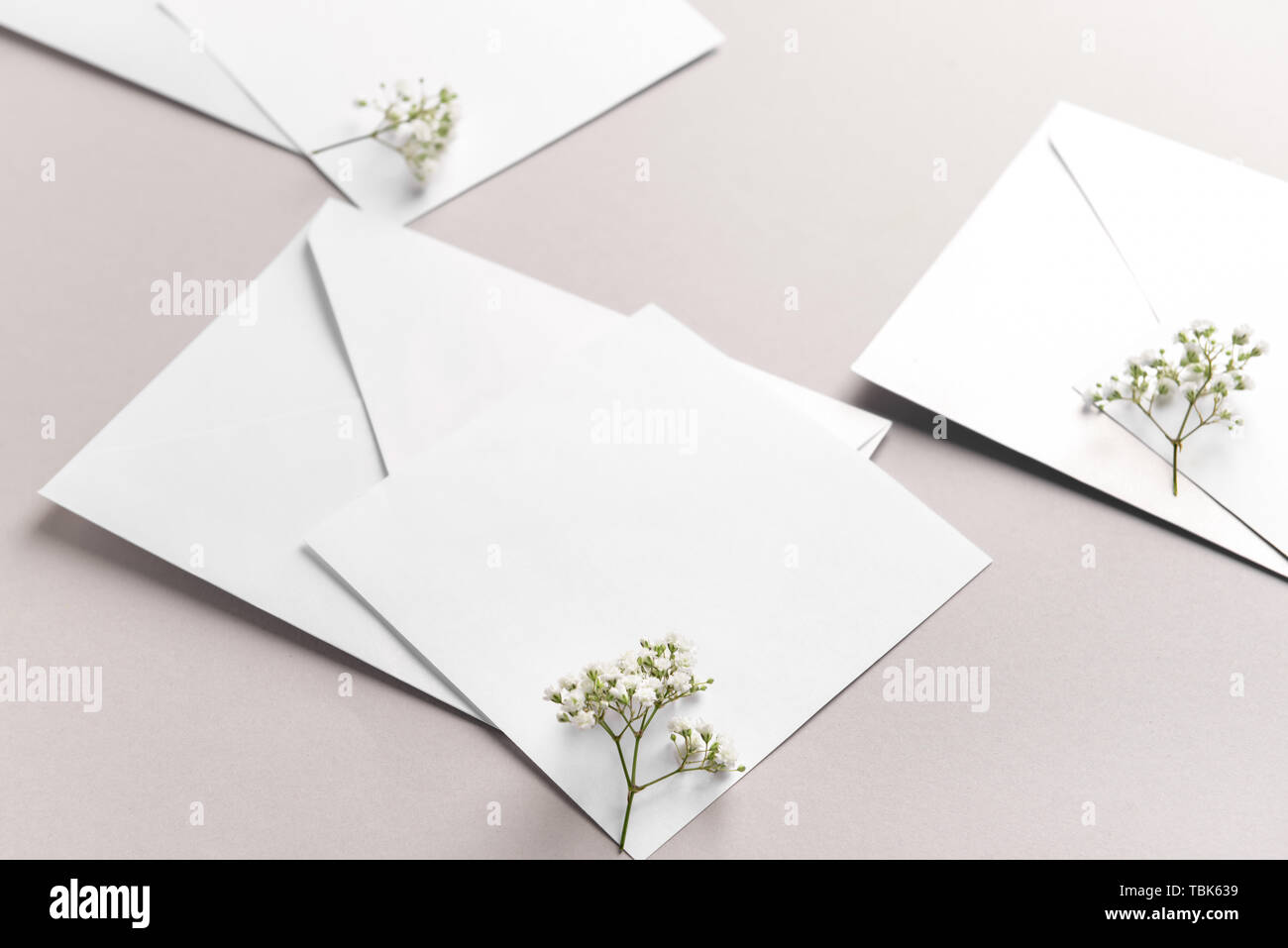 Mockups of invitations on grey background Stock Photo - Alamy