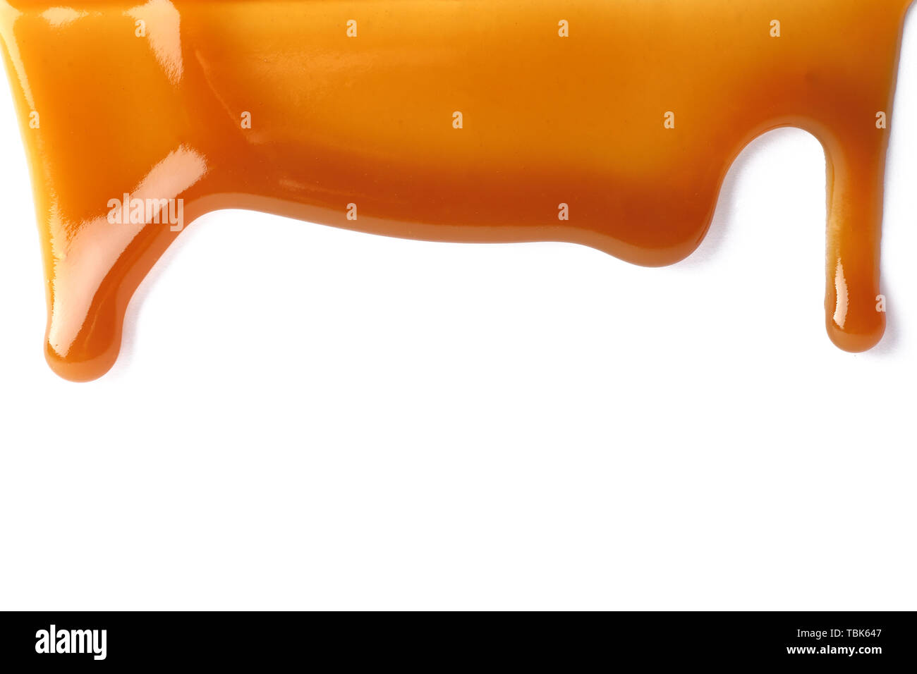 Stains of liquid caramel on white background Stock Photo - Alamy