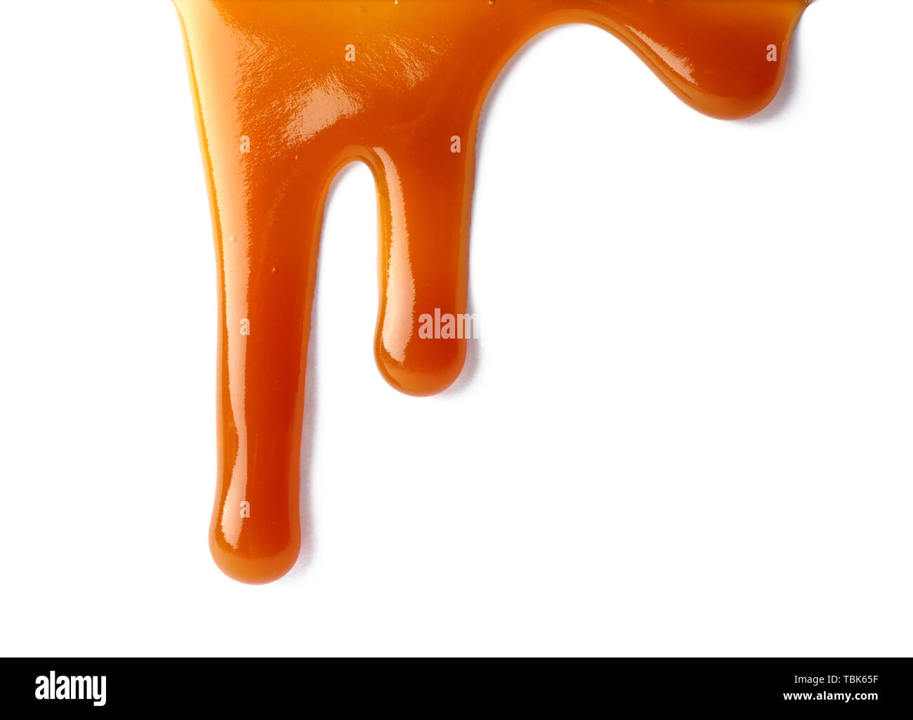 Stains of liquid caramel on white background Stock Photo - Alamy