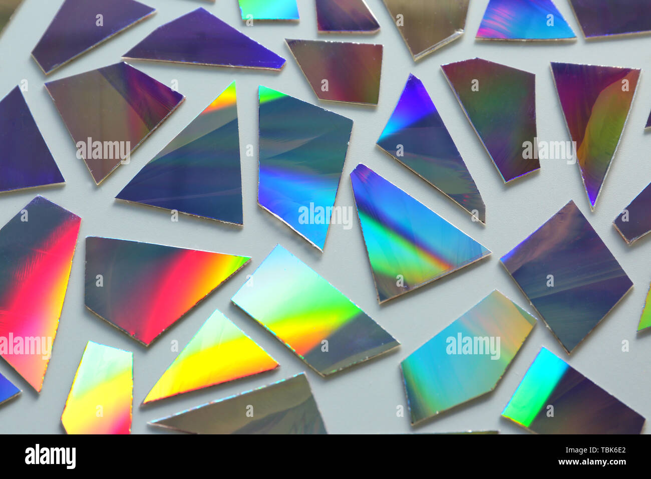 Shiny iridescent splinters on white background Stock Photo - Alamy