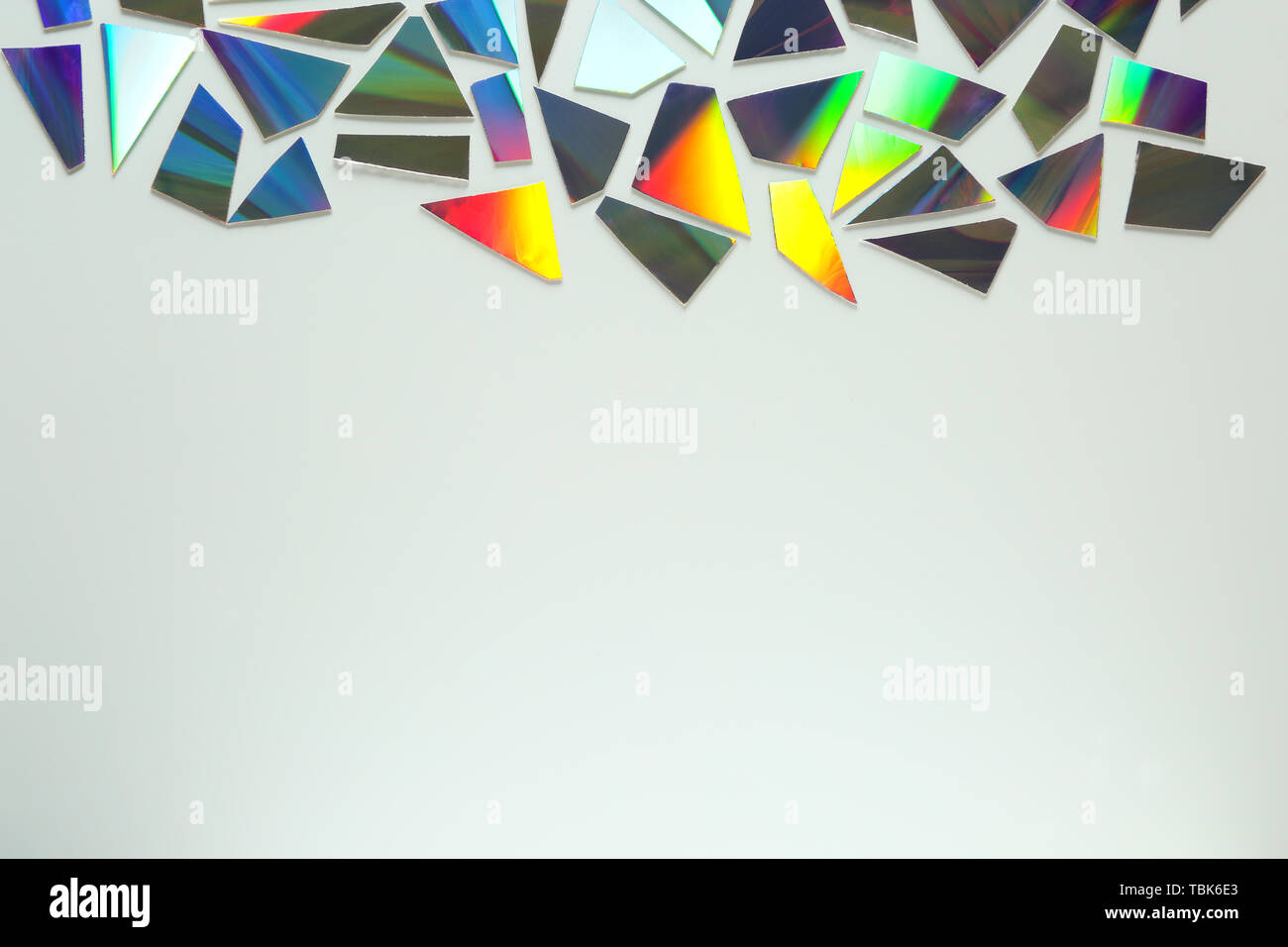 Shiny iridescent splinters on white background Stock Photo - Alamy