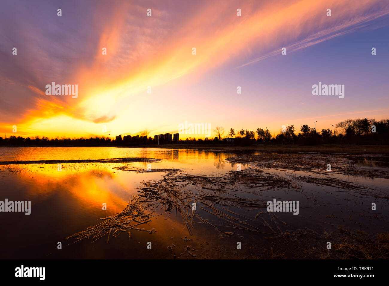 City view under the setting sun Stock Photo - Alamy
