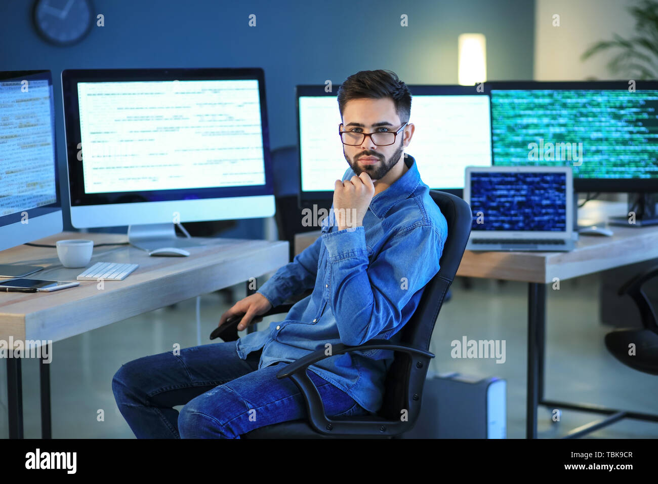 Male programmer working in office Stock Photo - Alamy
