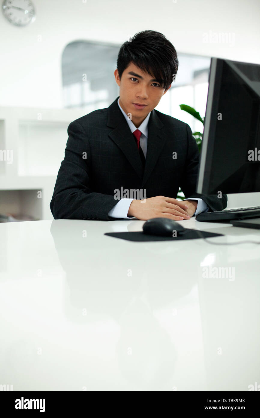 A white-collar man in front of a computer Stock Photo - Alamy