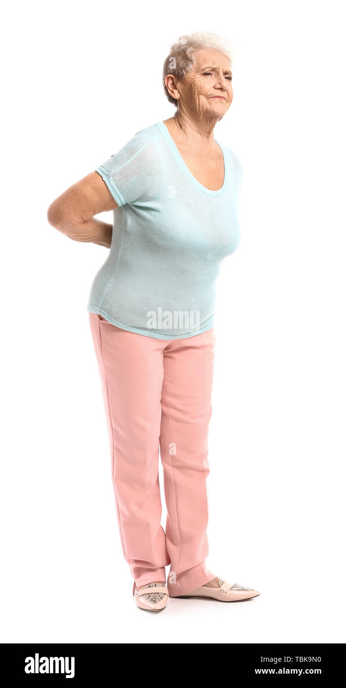 Senior woman suffering from back pain on white background Stock Photo ...