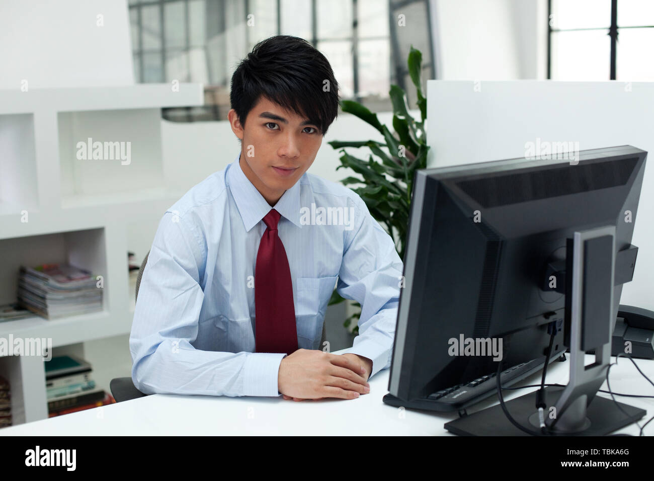 A white-collar man in front of a computer Stock Photo - Alamy