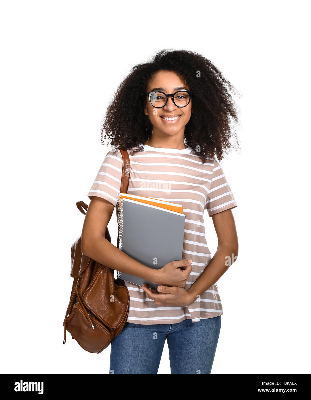 Beautiful African-American student on white background Stock Photo - Alamy