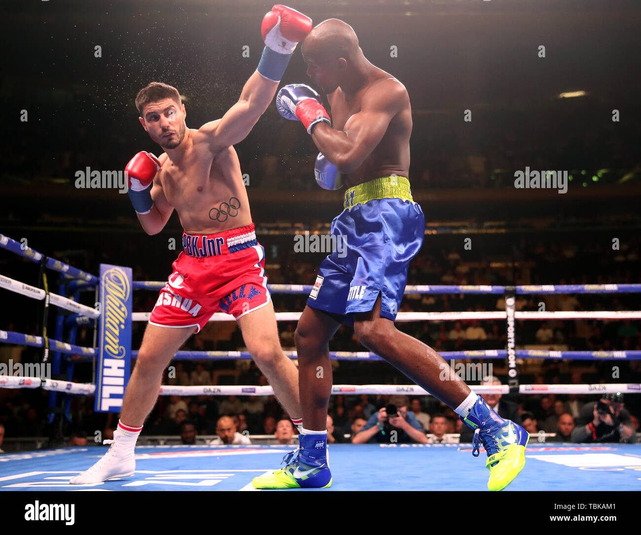Josh Kelly (left) in action against Ray Robinson in the WBA ...