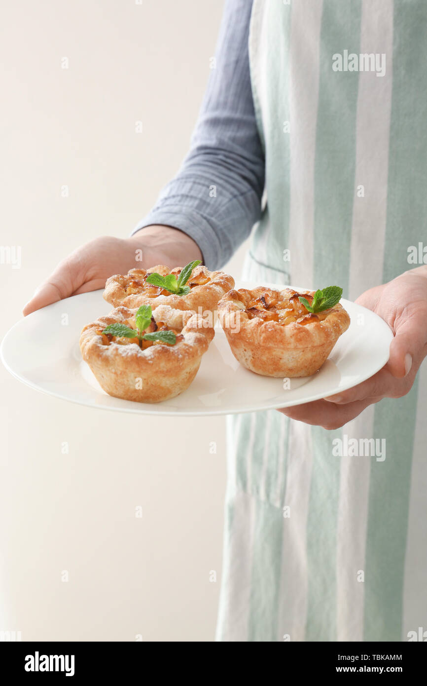 Eating mini pies woman hi-res stock photography and images - Alamy