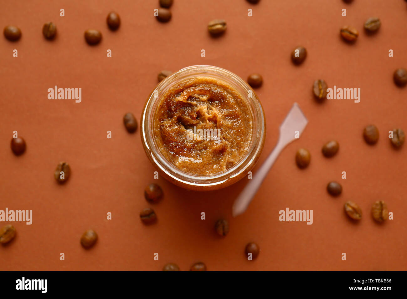 Jar of coffee sugar scrub on color background Stock Photo - Alamy