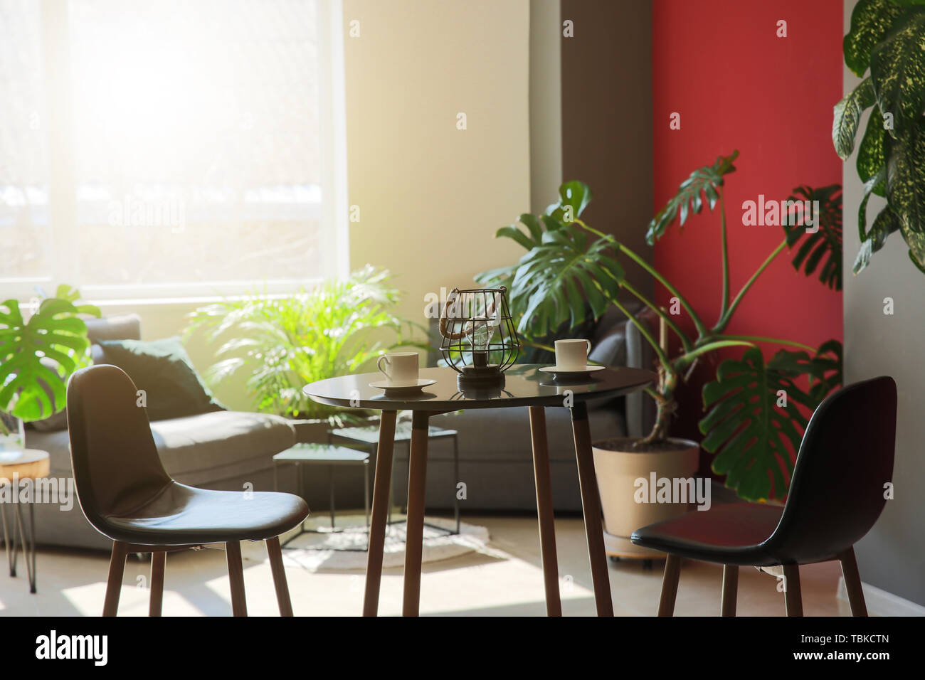 Interior of modern comfortable room with table and chairs Stock Photo ...