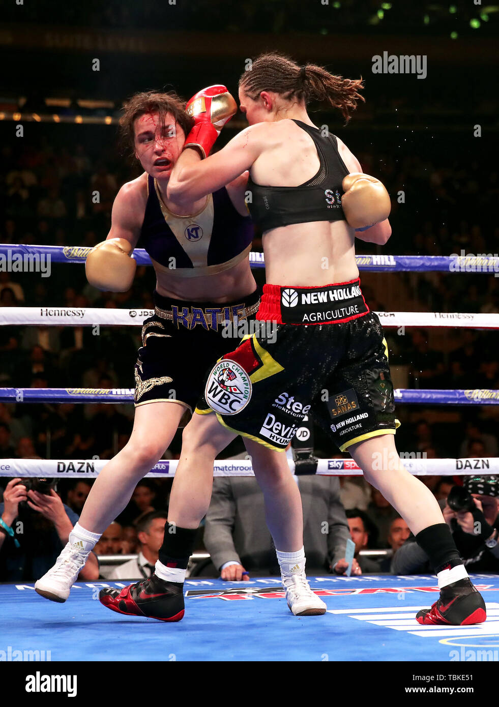 Katie Taylor (left) in action against Delfine Persoon in the IBF, WBC ...