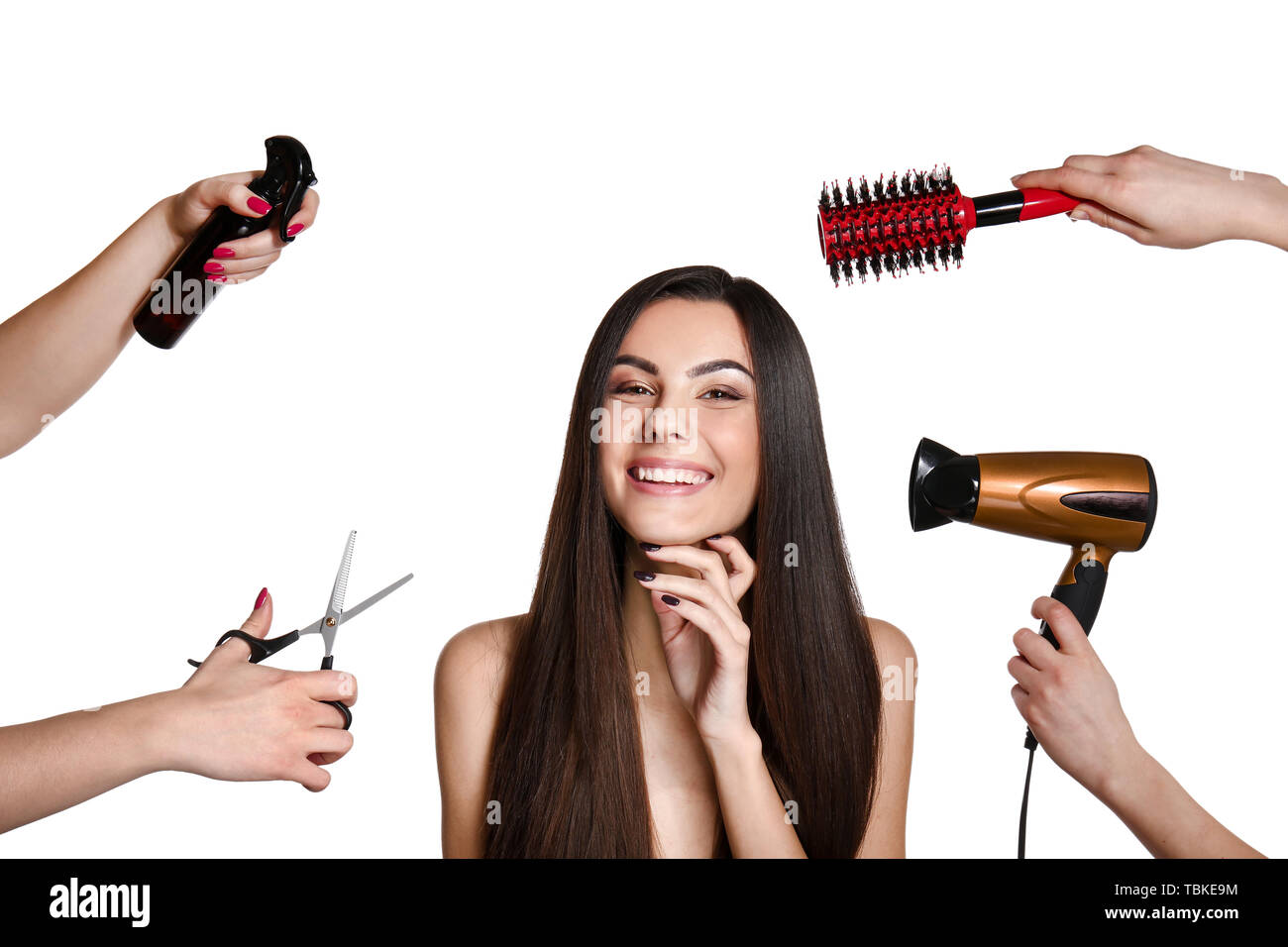 Beautiful young woman with healthy long hair and hairdresser's hands ...