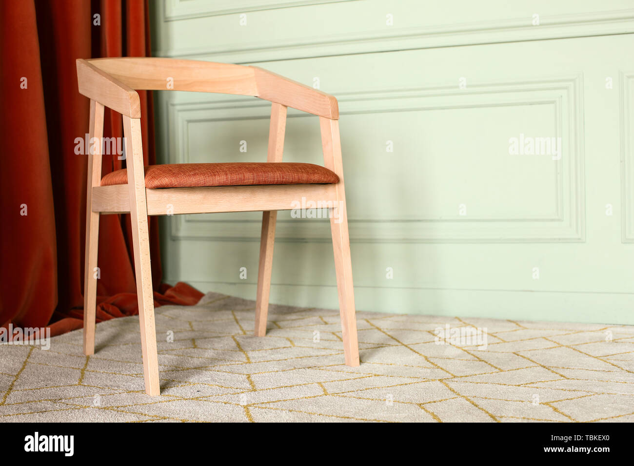 Modern wooden chair in interior of room Stock Photo - Alamy