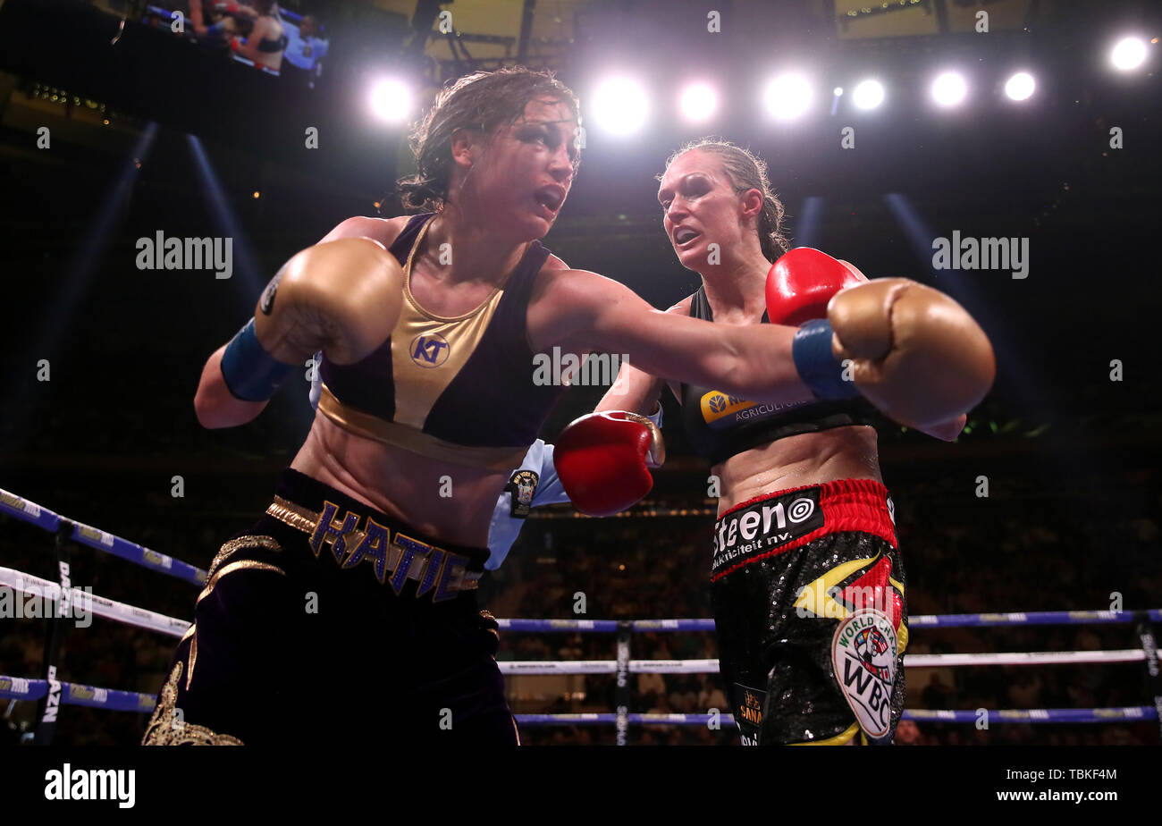 Katie Taylor (left) in action against Delfine Persoon in the IBF, WBC ...