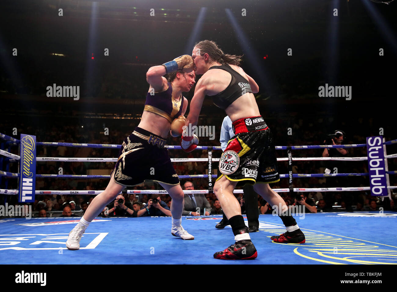 Katie Taylor (left) in action against Delfine Persoon in the IBF, WBC ...