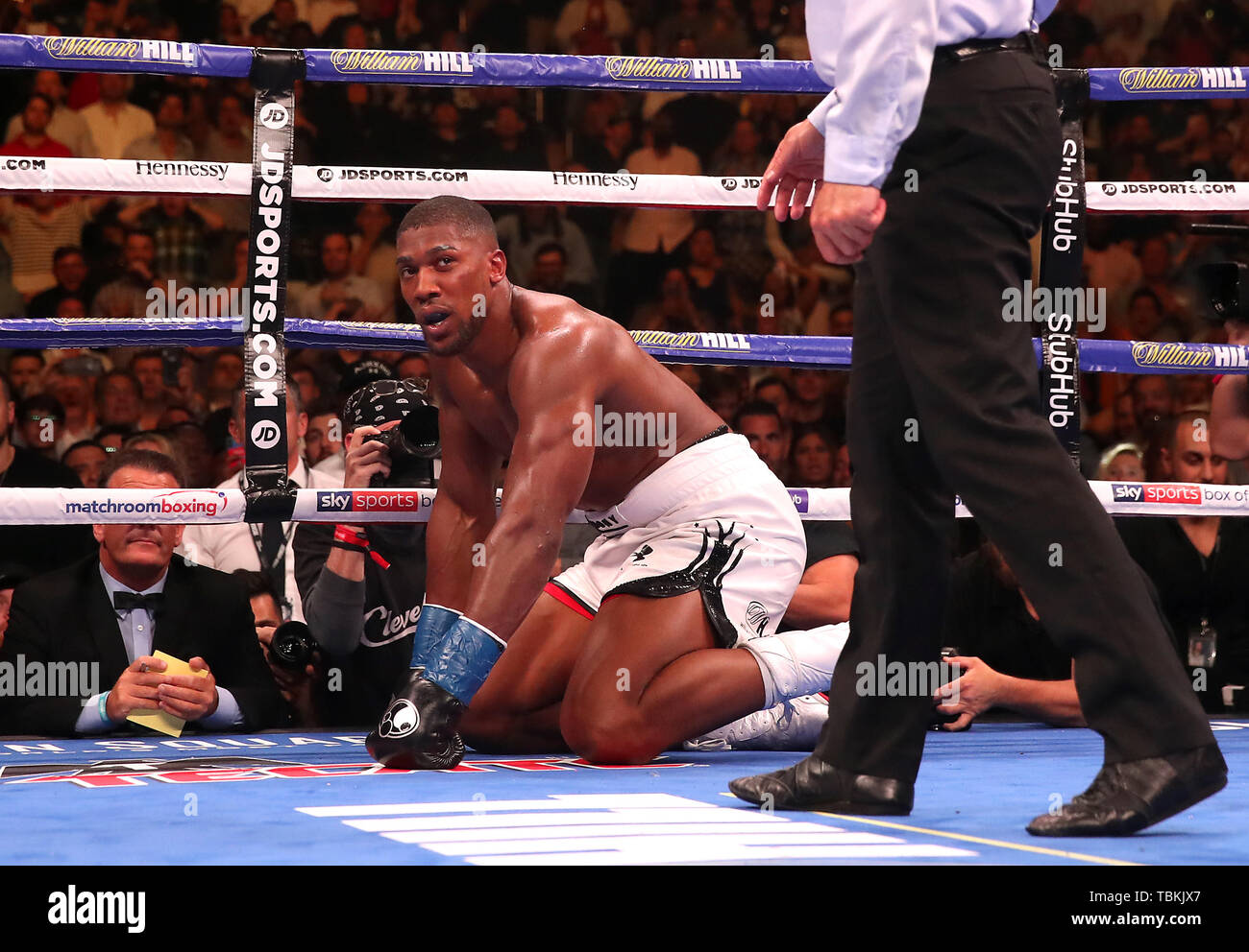Anthony Joshua (left) is counted down by referee Mike Griffen against ...