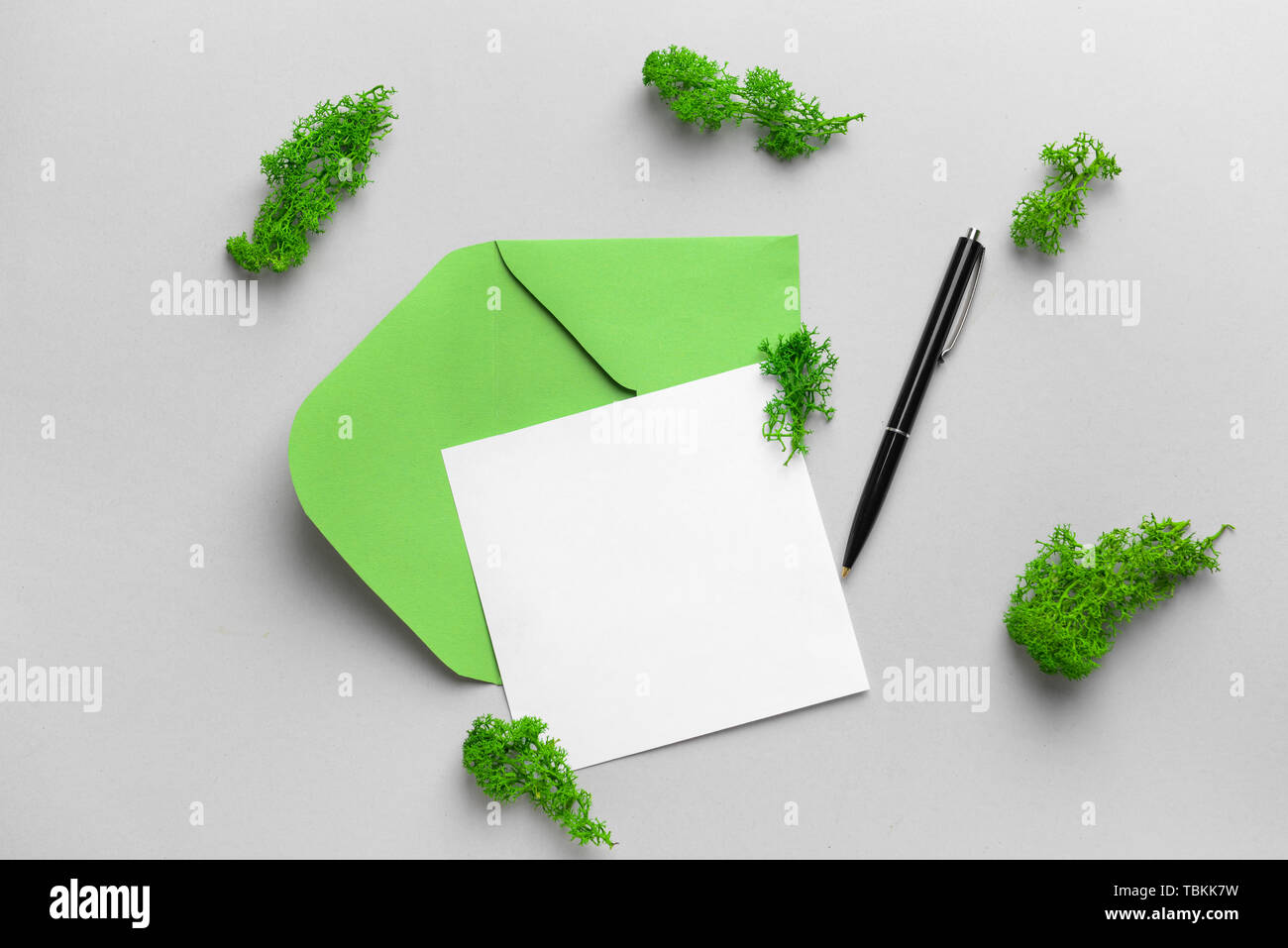 Mockup of invitation on grey background Stock Photo - Alamy