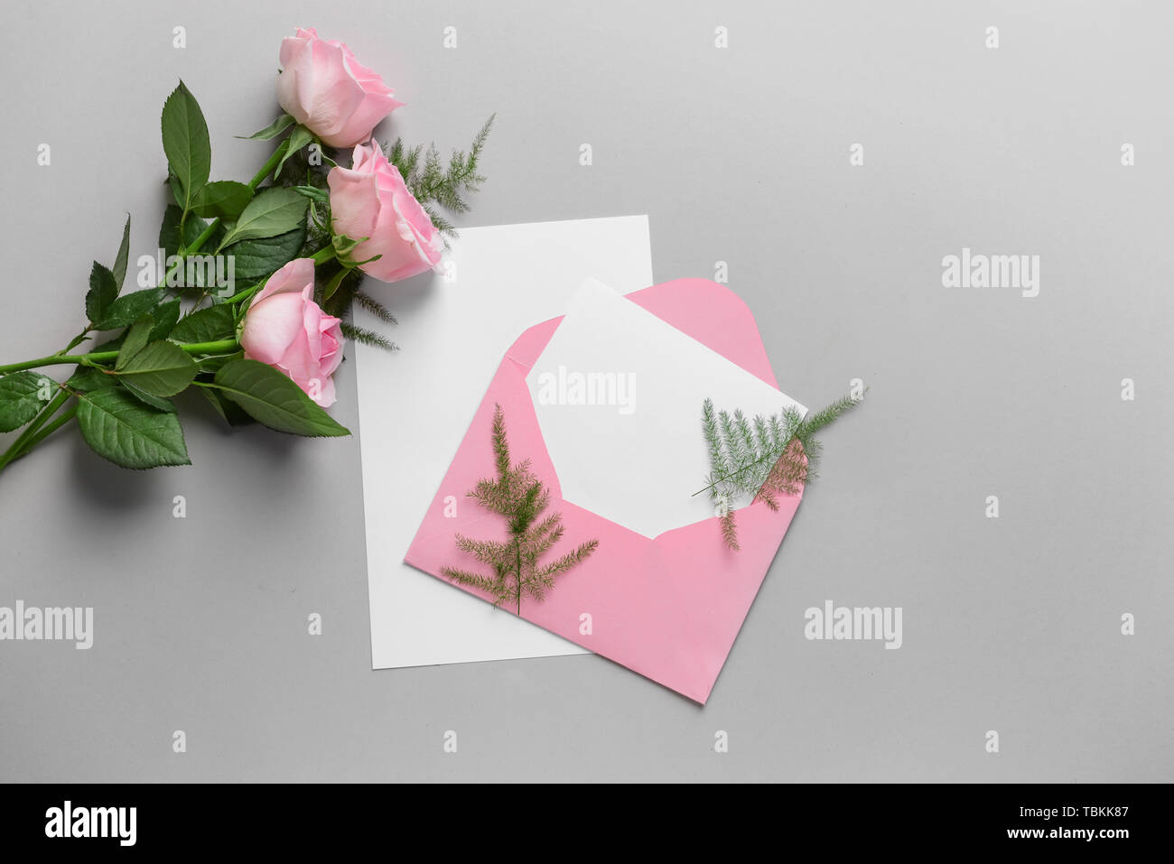 Mockup of invitation on grey background Stock Photo - Alamy