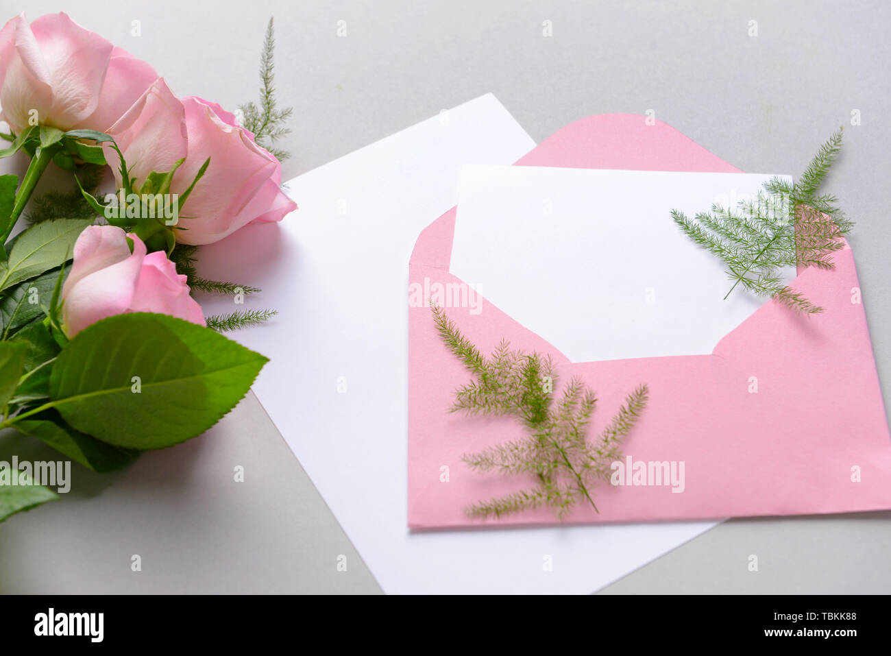 Mockup of invitation on grey background Stock Photo - Alamy