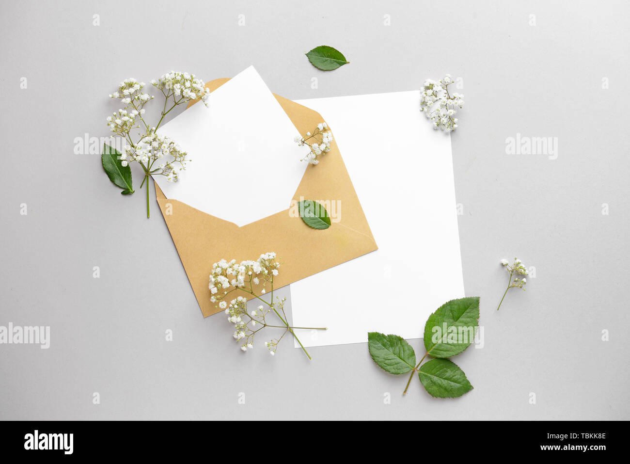 Mockup of invitation on grey background Stock Photo - Alamy