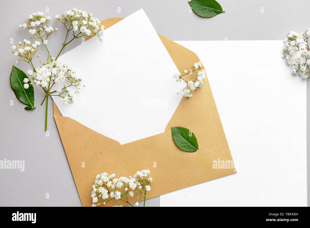 Mockup of invitation on grey background Stock Photo - Alamy