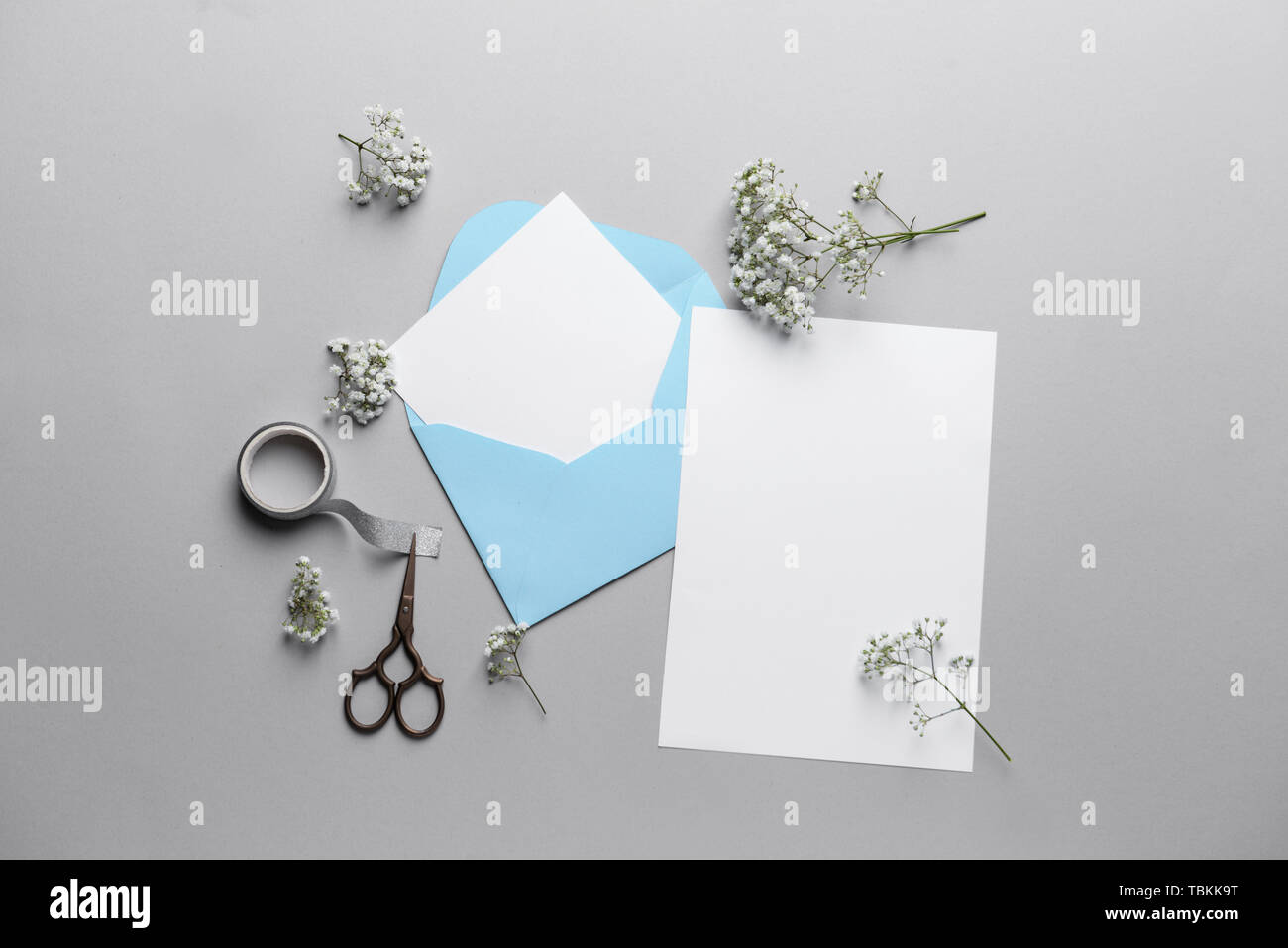 Mockup of invitation on grey background Stock Photo - Alamy