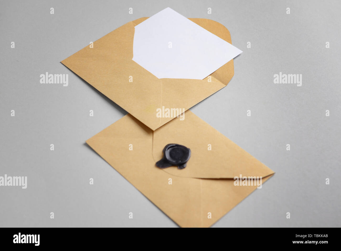 Mockup of invitation on grey background Stock Photo - Alamy