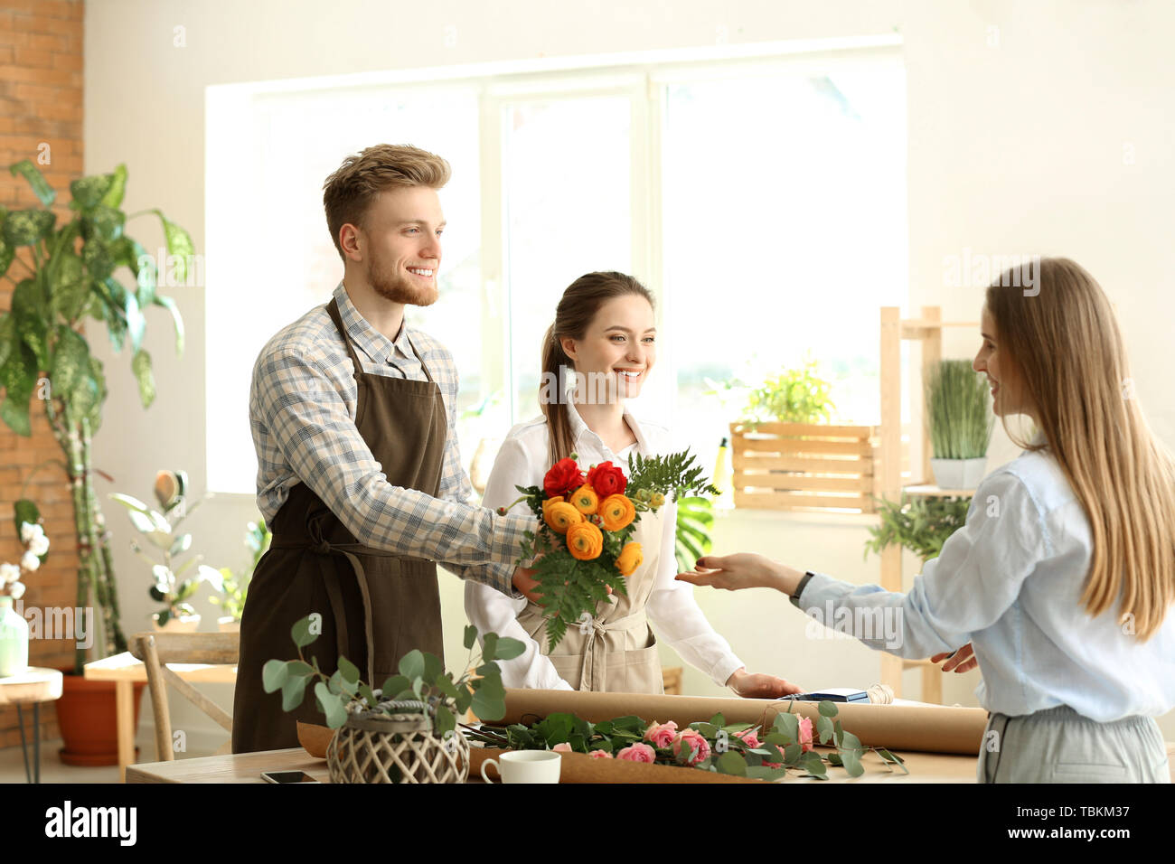 Workplace flowers man woman hi-res stock photography and images - Alamy