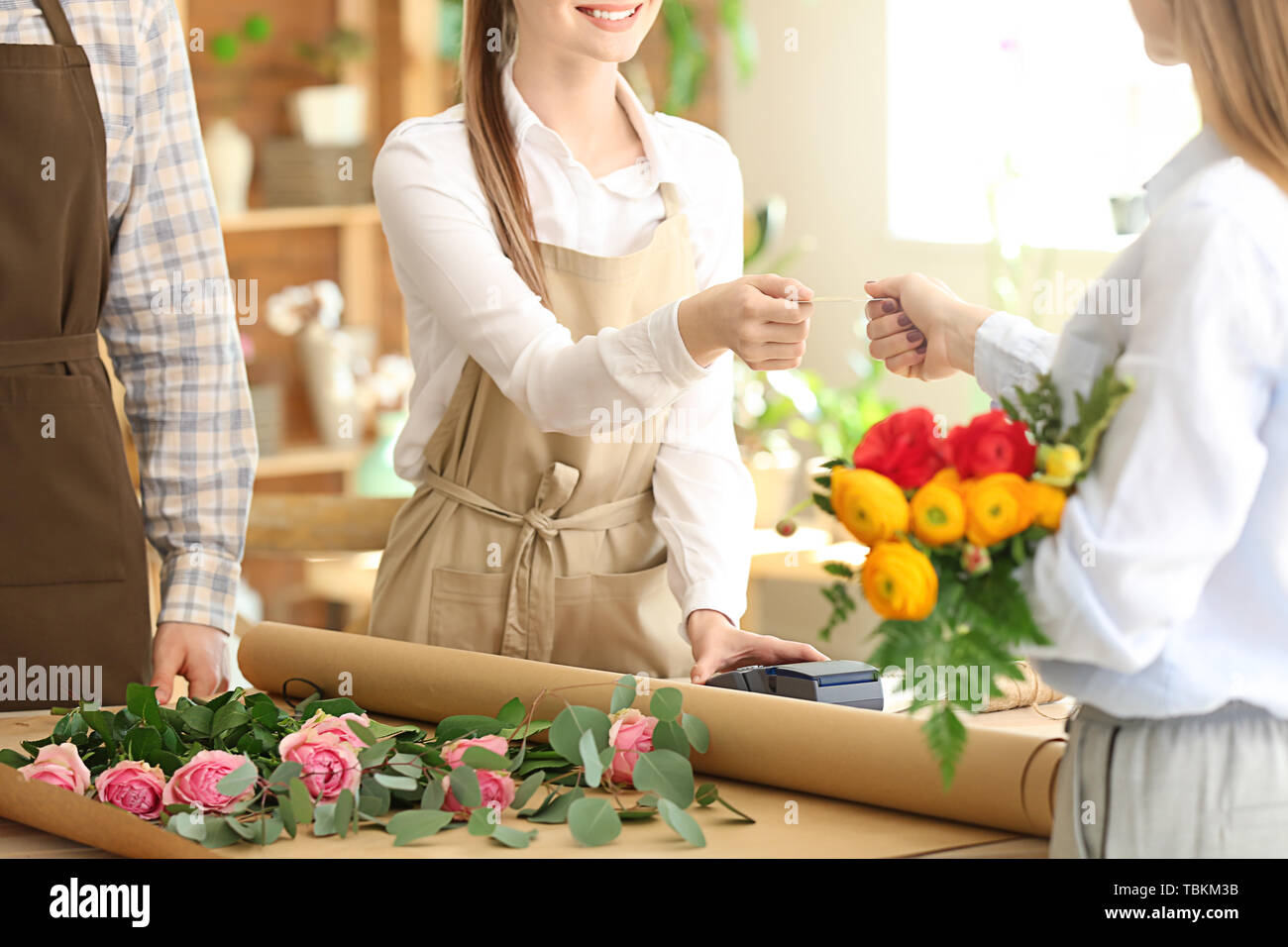 Workplace flowers man woman hi-res stock photography and images - Alamy