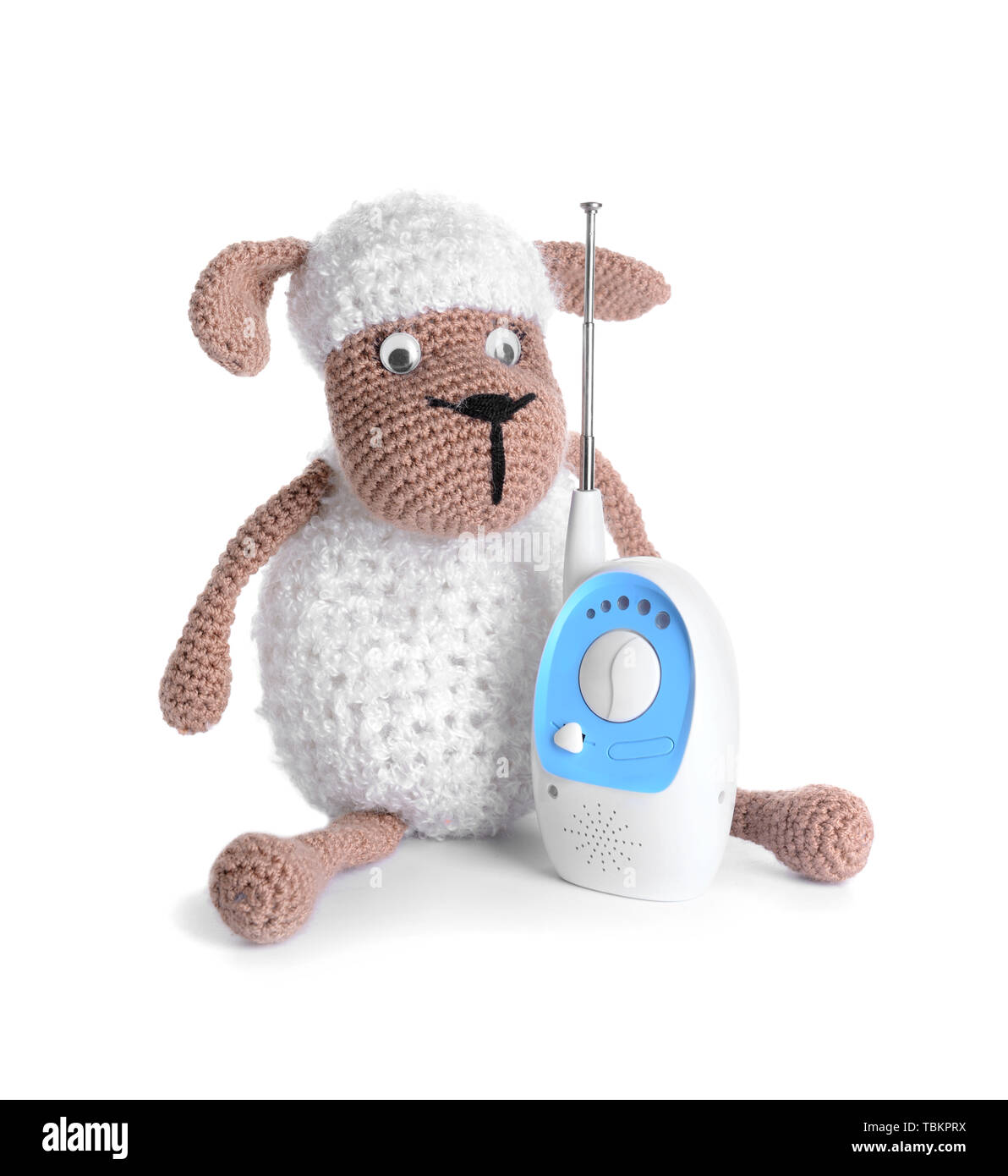 Modern baby monitor with toy on white background Stock Photo - Alamy