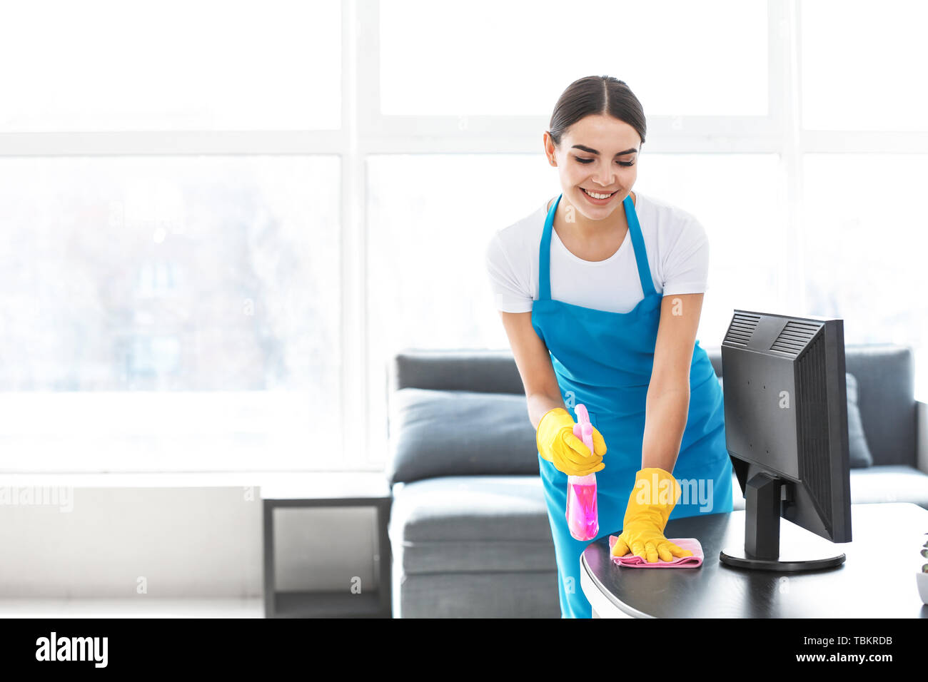 Female janitor cleaning office Stock Photo - Alamy