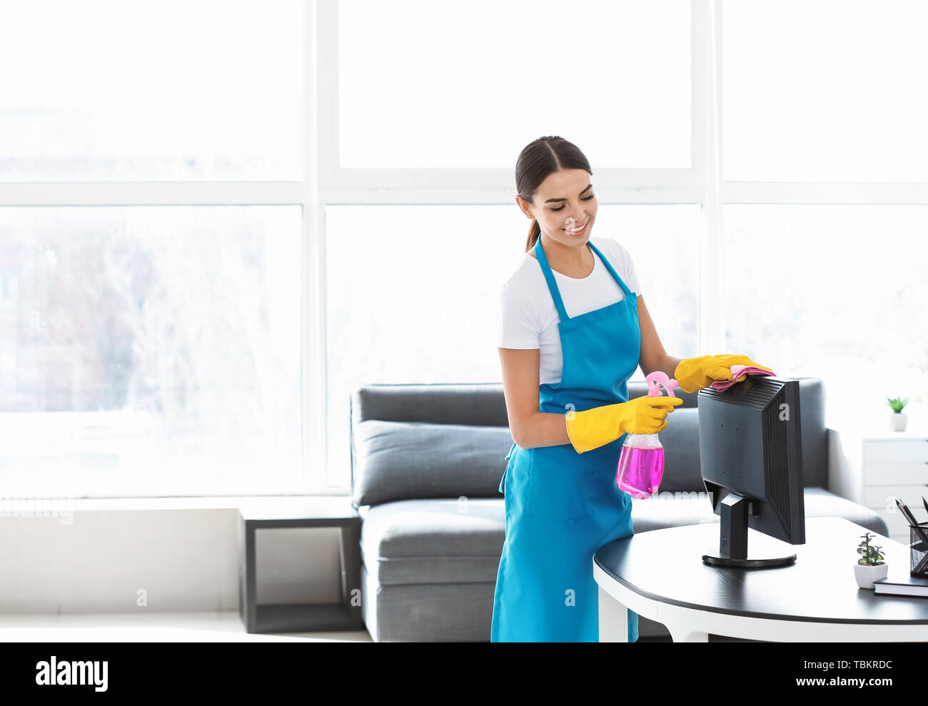 Female janitor cleaning office Stock Photo - Alamy