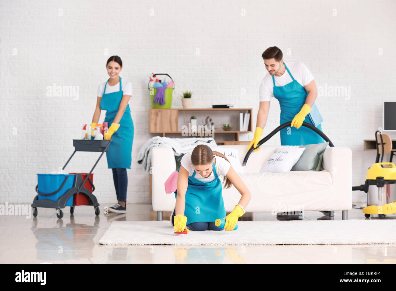 Group janitors cleaning equipment hi-res stock photography and images ...