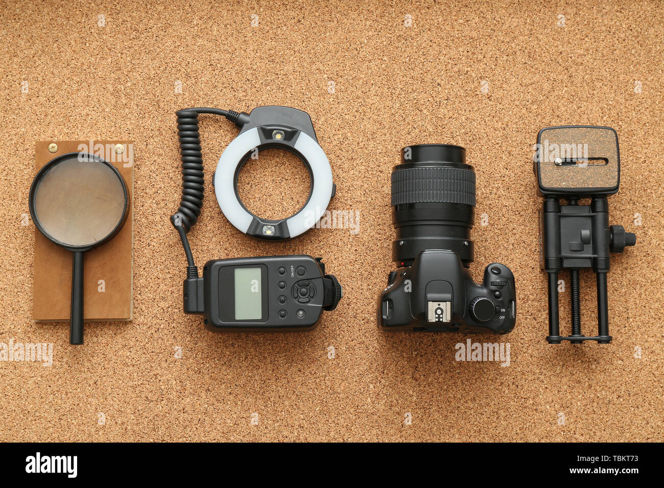 Modern equipment of professional photographer on cork background Stock ...