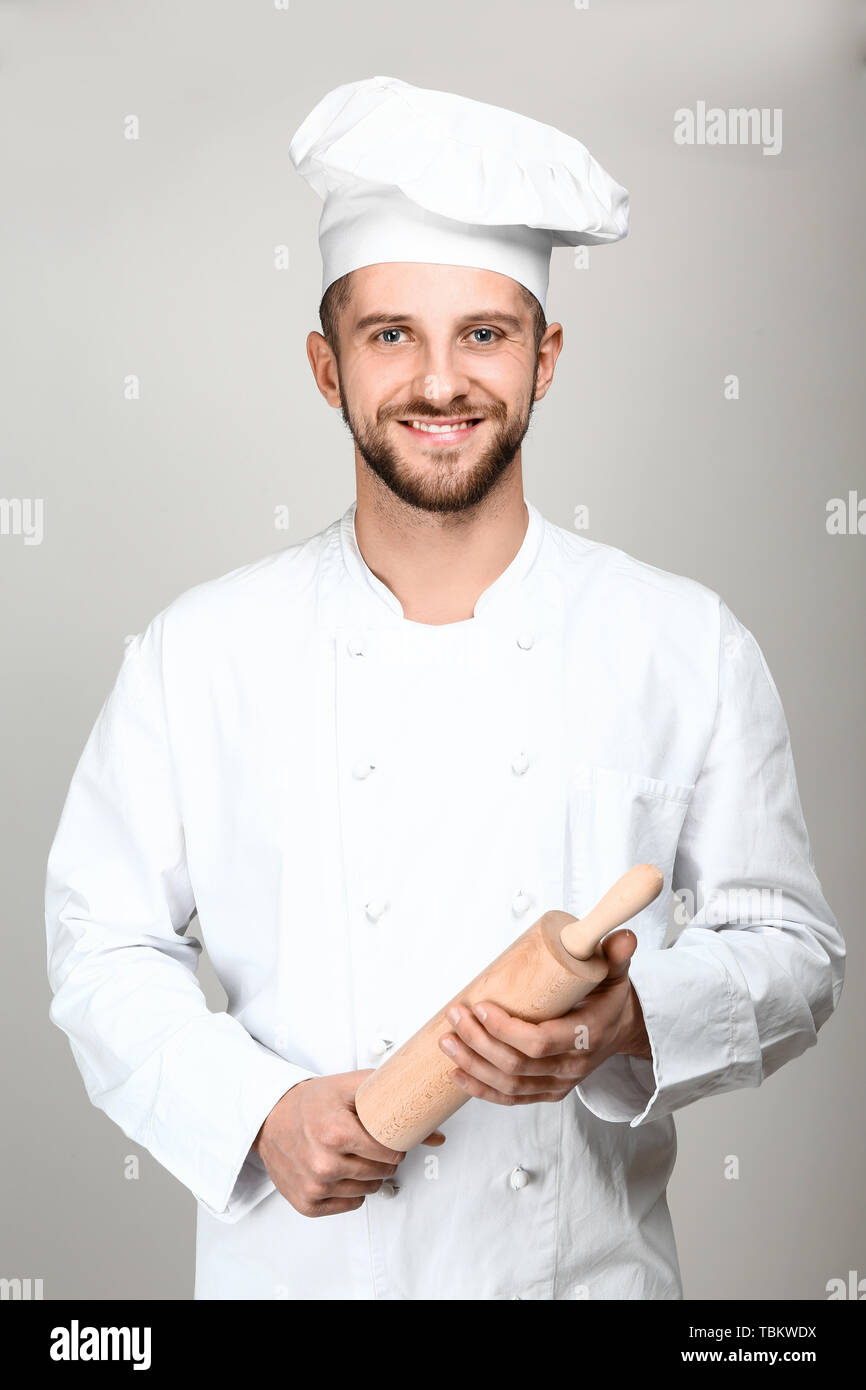 Male chef on light background Stock Photo - Alamy
