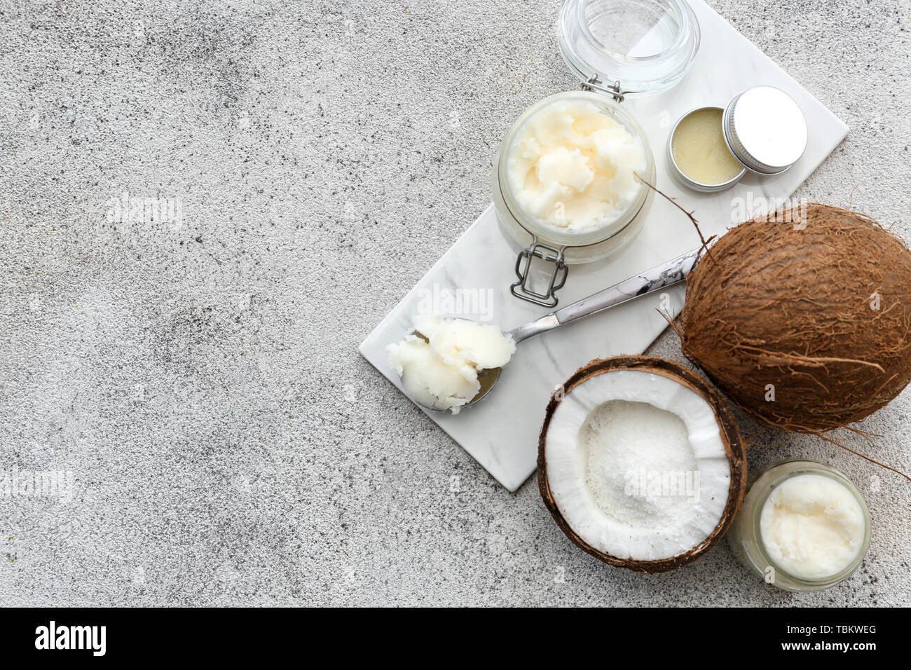 Composition with coconut oil on light background Stock Photo - Alamy