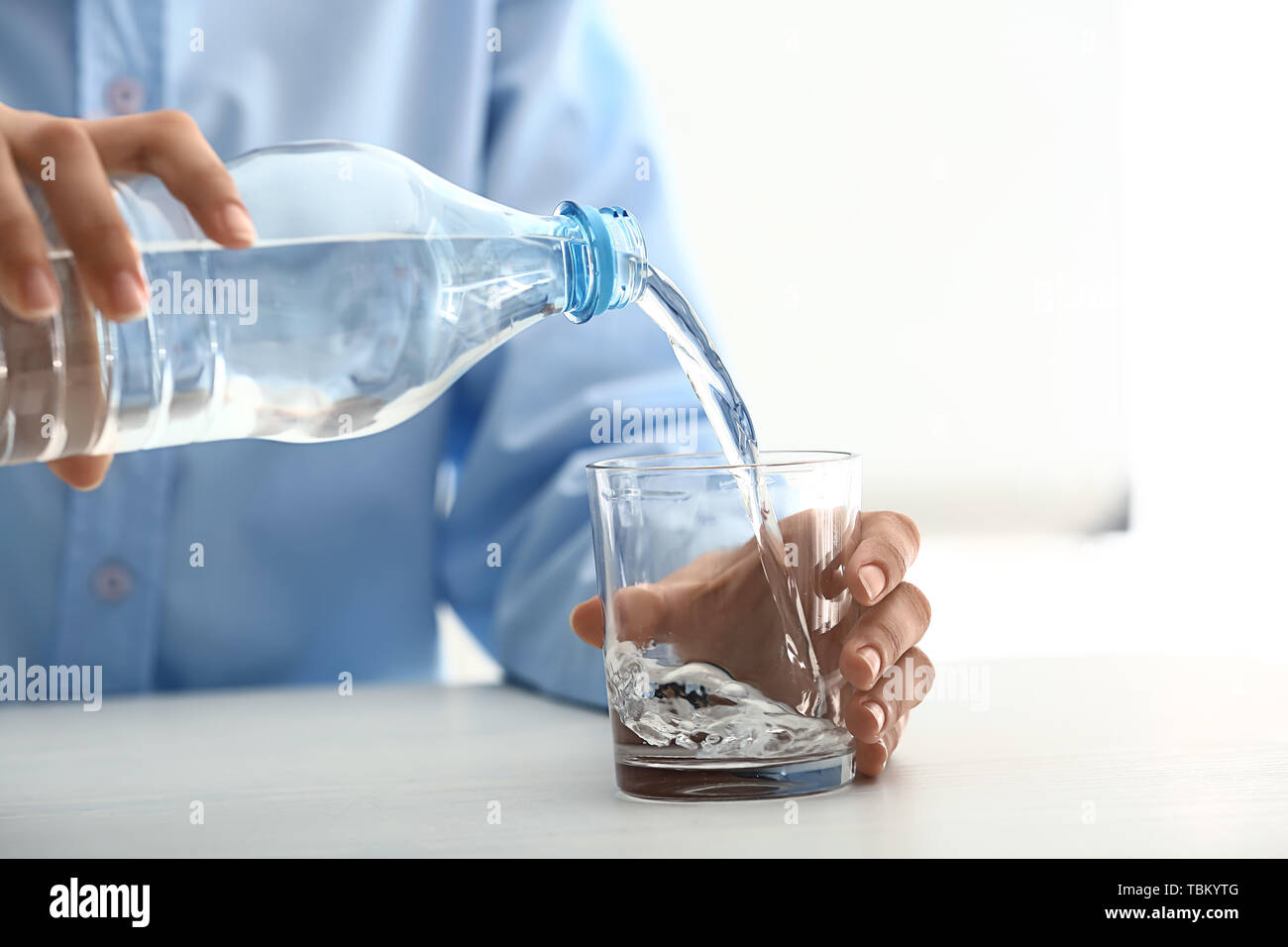 Woman pouring filtered water glass hi-res stock photography and images ...