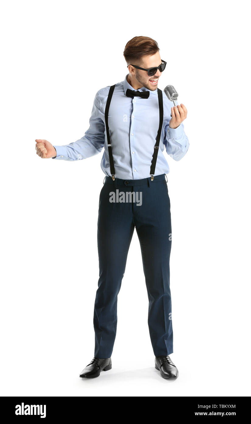 Handsome male singer with microphone on white background Stock Photo ...