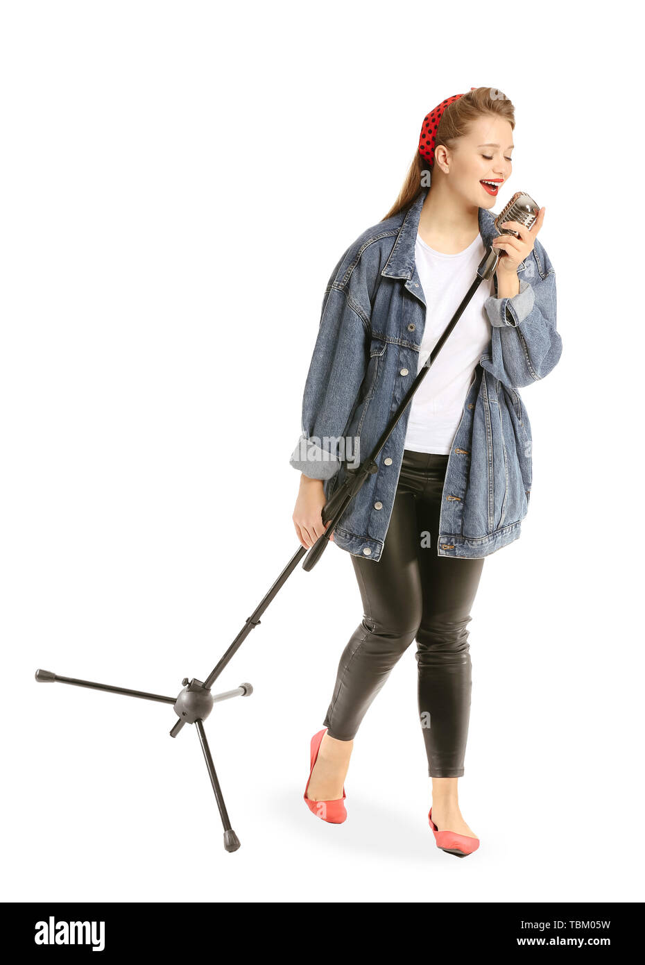 Beautiful female singer with microphone on white background Stock Photo ...