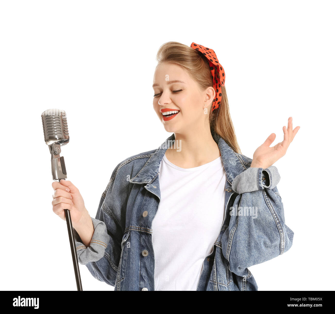 Beautiful female singer with microphone on white background Stock Photo ...