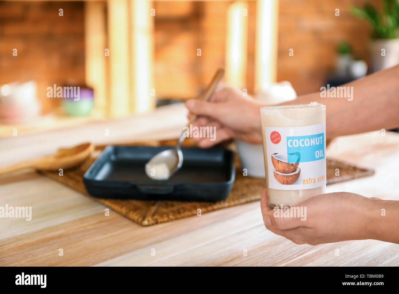 Woman cooking with oil hi-res stock photography and images - Alamy