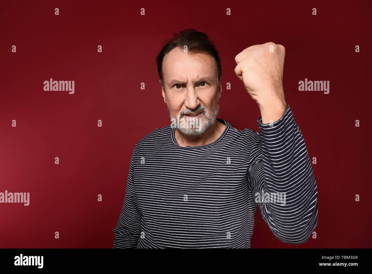 Angry handsome man showing middle hi-res stock photography and images ...