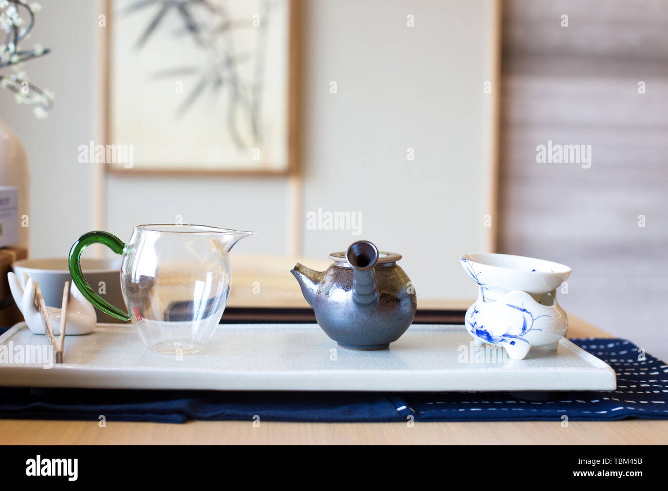 elegant ceramic tea sets on table in modern living room Stock Photo - Alamy