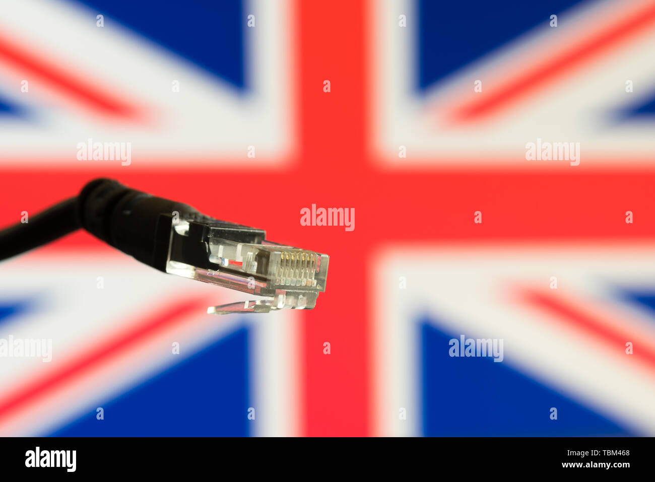 Ethernet cable with United Kingdom flag in the background symbolizing ...
