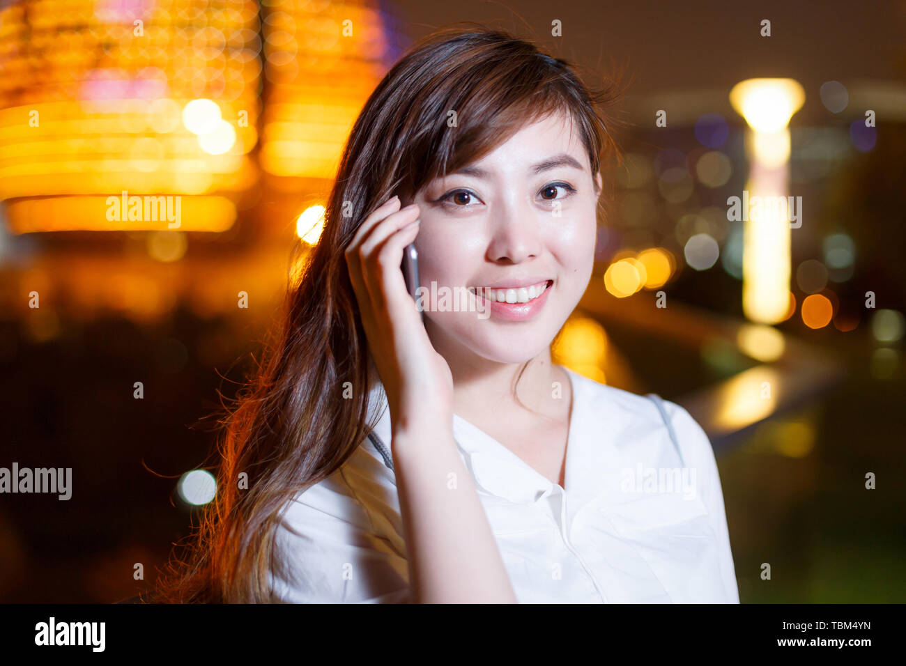 Asian girl using mobile phone hi-res stock photography and images - Alamy