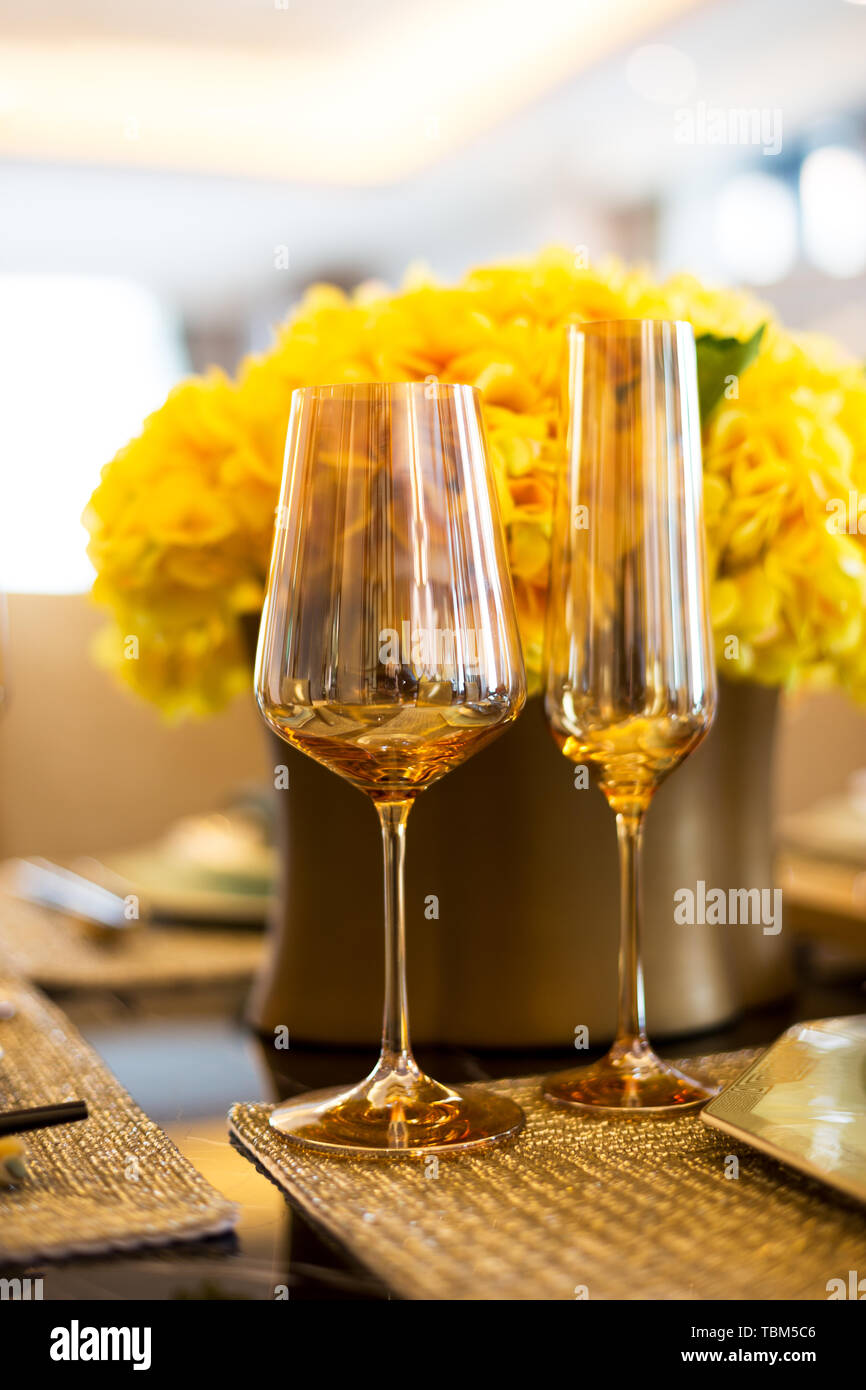 elegant crockery on dining table in modern dining room Stock Photo - Alamy