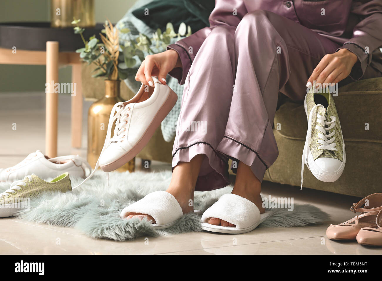 Woman changing shoes home hi-res stock photography and images - Alamy