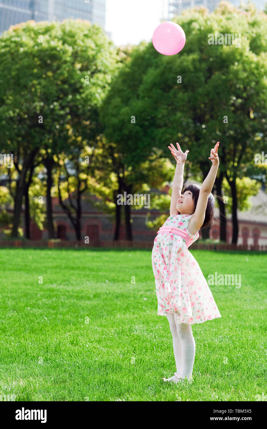a girl playing outdoors Stock Photo - Alamy